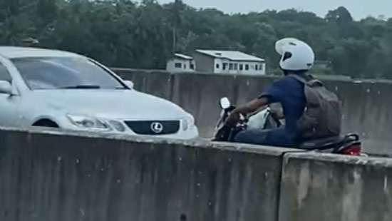 Cop in soup for riding motorcycle on expressway - Breaking News | Daily ...