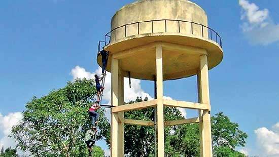 Children climb on to 60 feet high water tank for online education ...