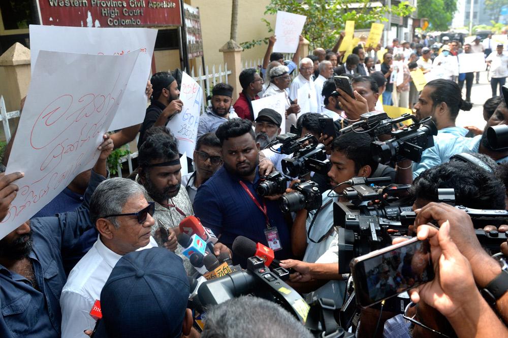 Silent protest over Lasantha Wickramathunga murder case - Caption Story ...