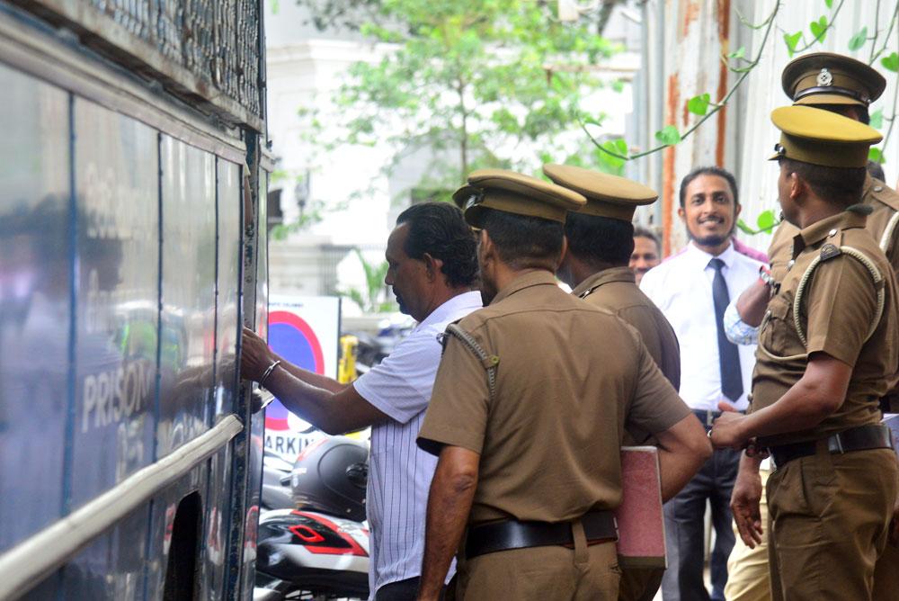 Handcuffed... - Caption Story | Daily Mirror