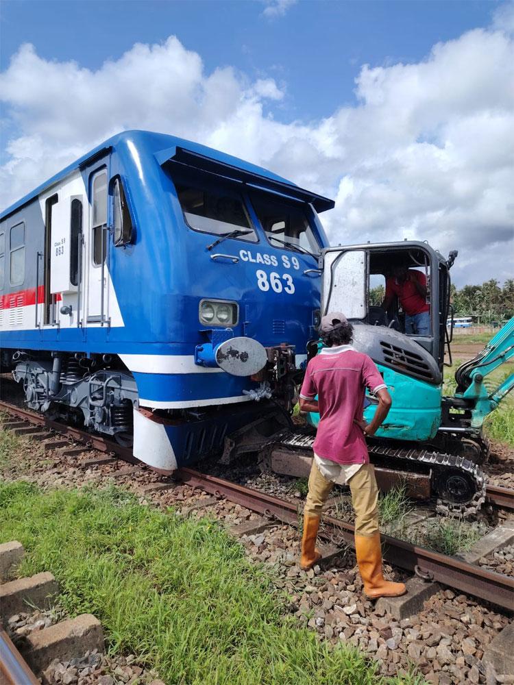 Train engine collides with mini excavator on main line near Mirigama ...
